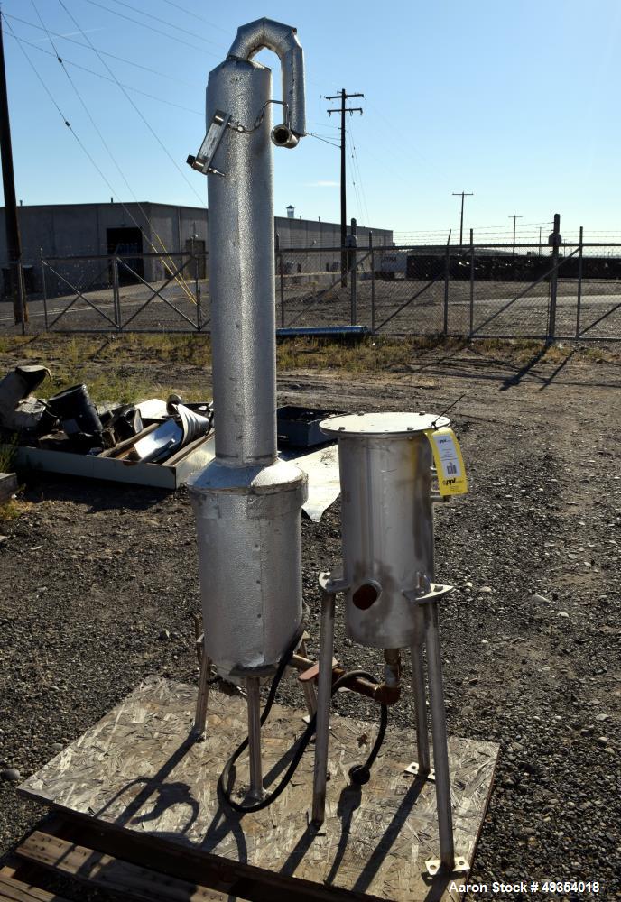 Used Still, Stainless Steel. With bubble tray column and holding tank.