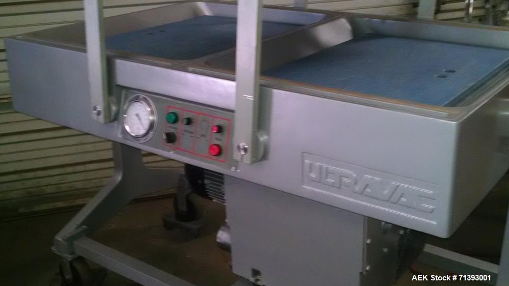 Used Ultravac 2000 Vacuum Packaging Machine. 27" seal bars, 32" inbet