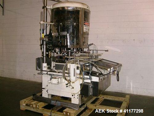 Used Pneumatic Scale 8 Head Rotary Chuck Capper. Capable of speeds up