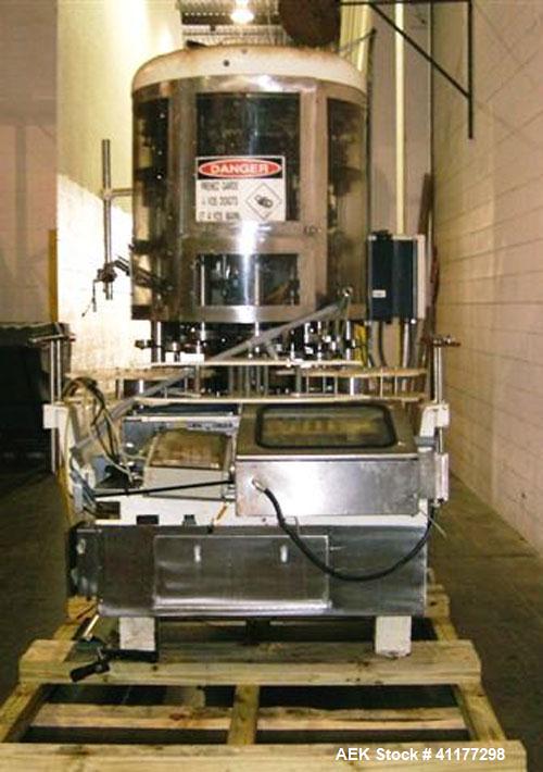 Used Pneumatic Scale 8 Head Rotary Chuck Capper. Capable of speeds up