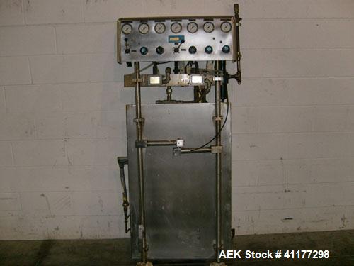 Used Pneumatic Scale 8 Head Rotary Chuck Capper. Capable of speeds up