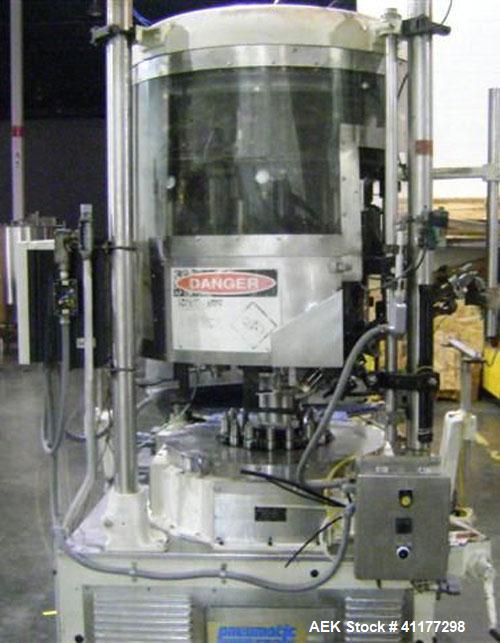 Used Pneumatic Scale 8 Head Rotary Chuck Capper. Capable of speeds up