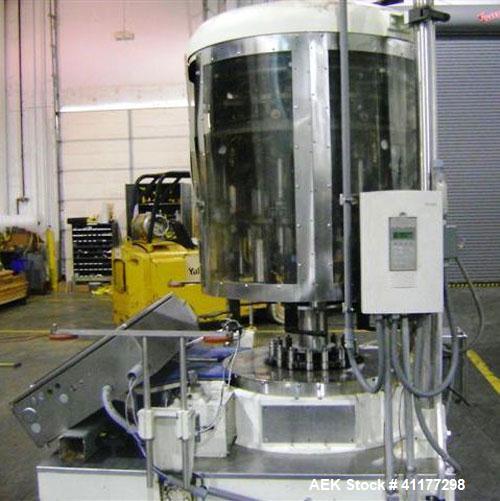 Used Pneumatic Scale 8 Head Rotary Chuck Capper. Capable of speeds up