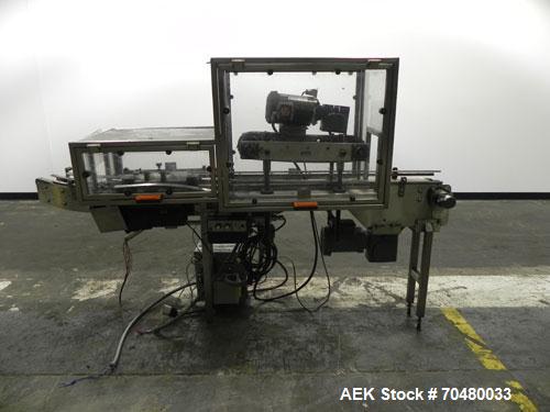 Used Inline Bottle snap lid press. Machine has 5" high belt. Has a wo