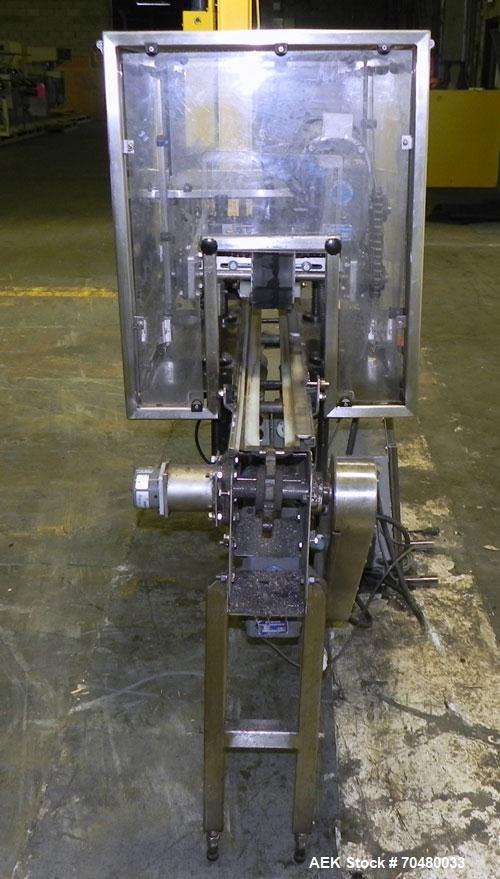 Used Inline Bottle snap lid press. Machine has 5" high belt. Has a wo