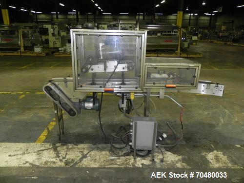 Used Inline Bottle snap lid press. Machine has 5" high belt. Has a wo