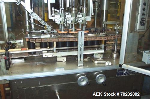 Used Resina model NRU30-1423 Inline Quill Style Capper. Equipped with