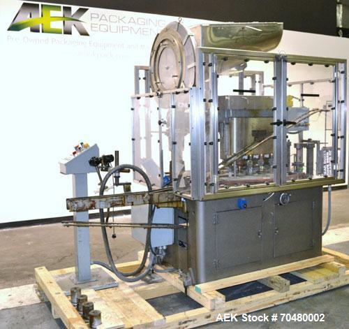 Used Resina Model U40 Automatic Inline Quill Capper. Capable of speed