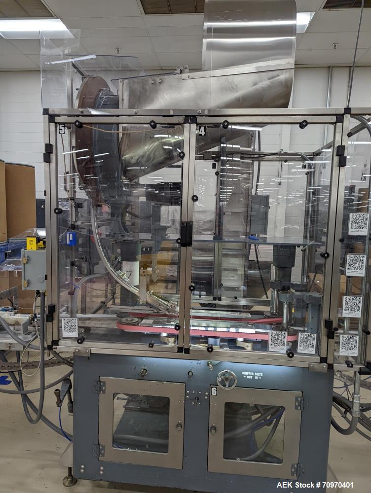UsedResina Model U30 automatic inline snap capper. Capable of speeds