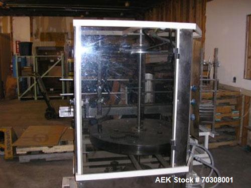 Used: Triangle Model VCL-1500 Continuos Motion Vertical Cartoner. Mac