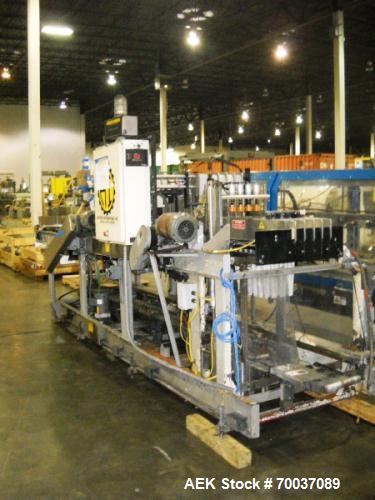 Used Hartness, Model 825 Case Packer. Approximate production rate: 30