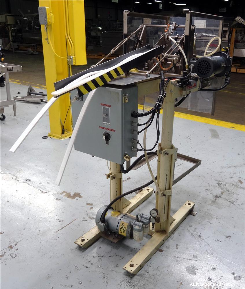 Used Thiele Engineering Model 34-000 Rotary Coupon Placer. Has magazi