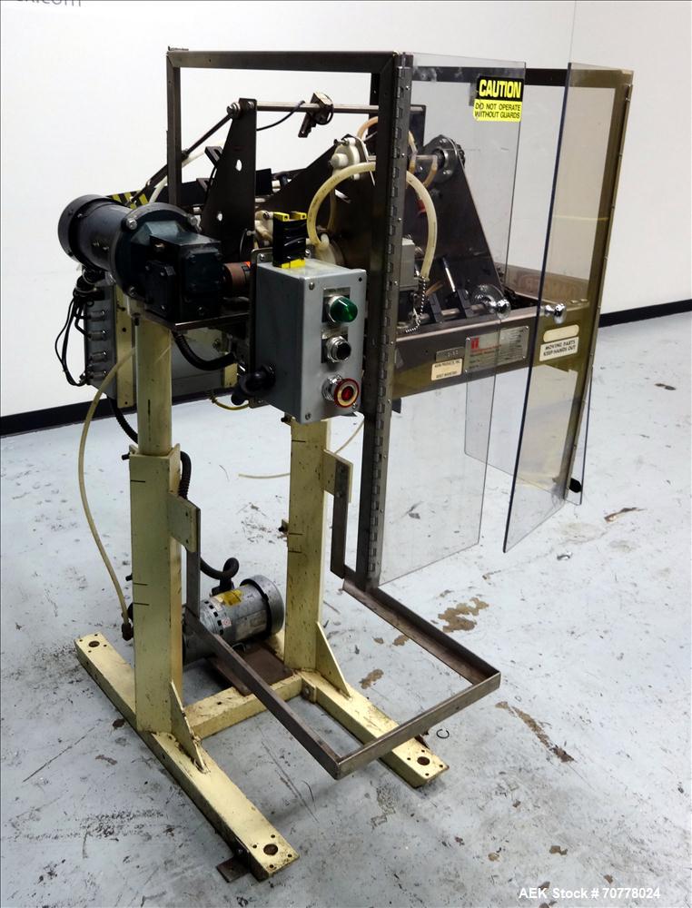 Used Thiele Engineering Model 34-000 Rotary Coupon Placer. Has magazi
