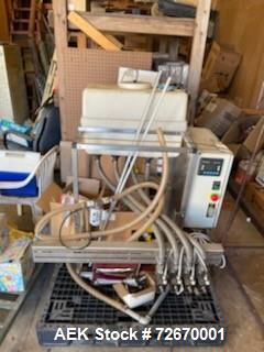 UsedEpak Tabletop 4 Head Inline Time Gravity Filler. Benchtop unit ha