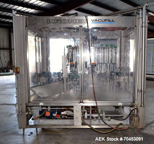 Used Krones 28 Head Model VV 28-107 Vacufill Rotary Vacuum Filler. Co