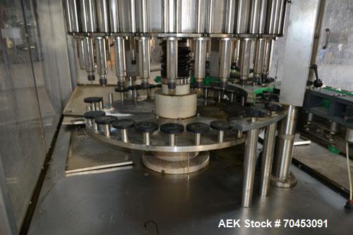 Used Krones 28 Head Model VV 28-107 Vacufill Rotary Vacuum Filler. Co