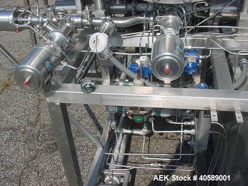 UsedRaque Piston Filler, stainless steel. 100 gallon aseptic tank wit