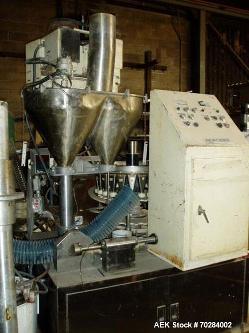 Used Mateer Burt 24 pocket rotary auger filler. Has worm screw infeed