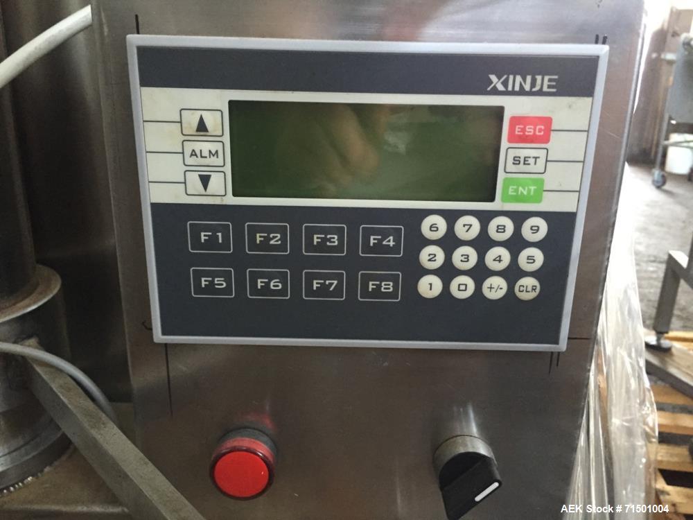 Used Noah Model CF-5B Semi-Automatic Powder Auger Filler. Capable of