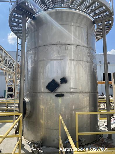 Used Approximate 8000 Gallon Stainless Steel, Vertical Storage Tank.