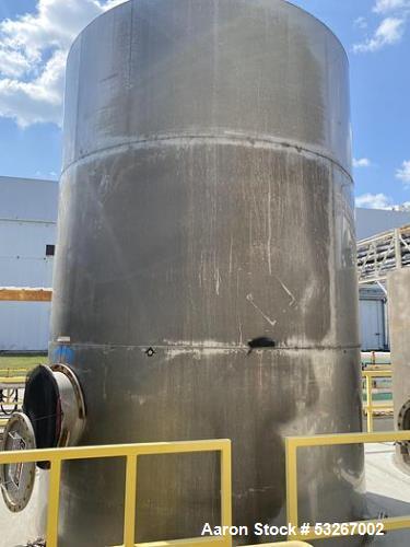 Used approximately 8000 gallon vertical stainless steel storage tank.
