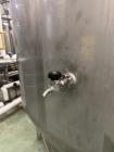 Used DCI 5,000 gallon Vertical Single Wall Mix Tank. Side agitation.